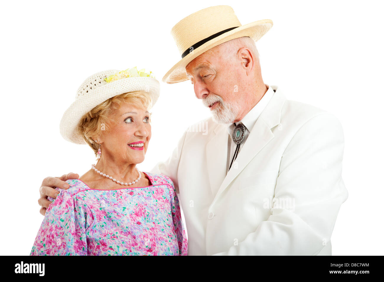 Handsome senior gentleman flirting with a beautiful senior lady ...