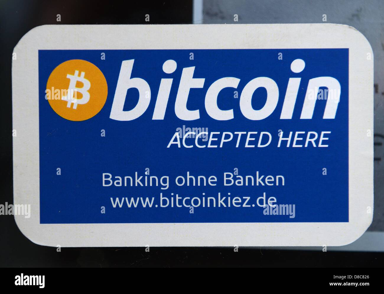 "Bitcoin accepted here" is posted at the entrance to a bar in Berlin ...
