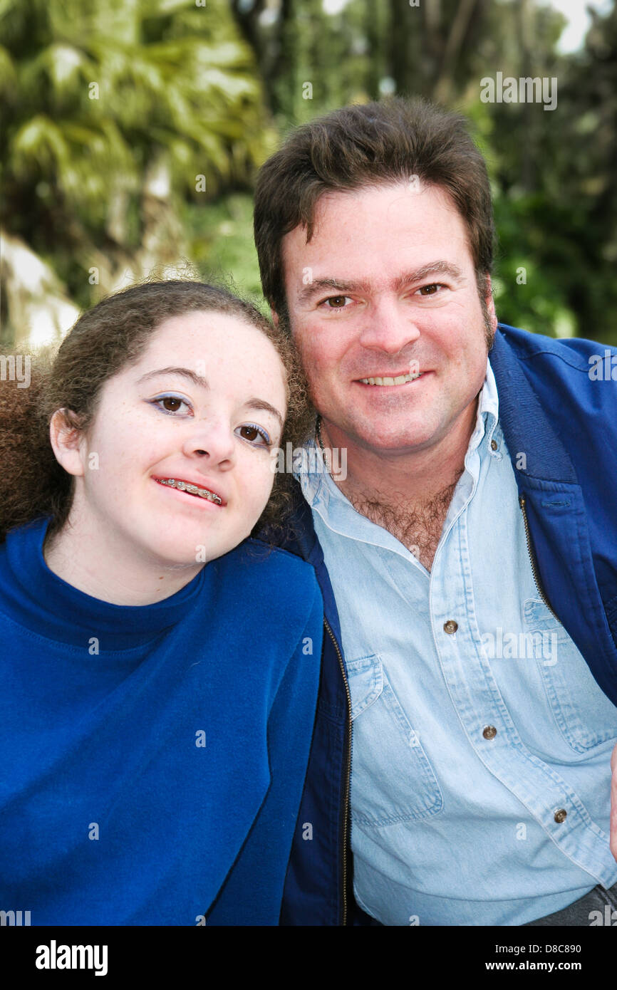 Portrait of a father and his teenage daughter posing outdoors Stock ...