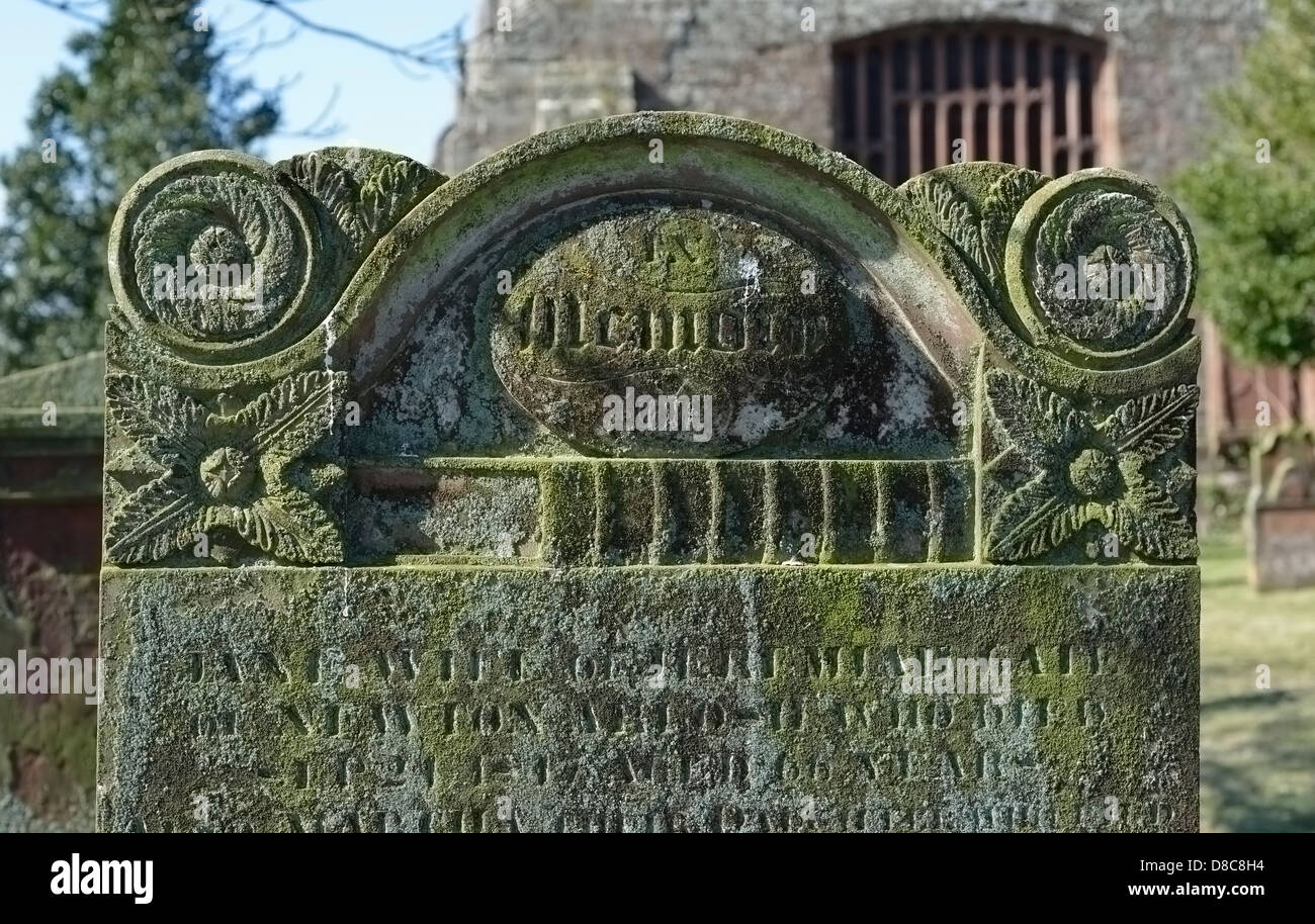 Gravestone with book and stylized floral design (detail). Church of St ...