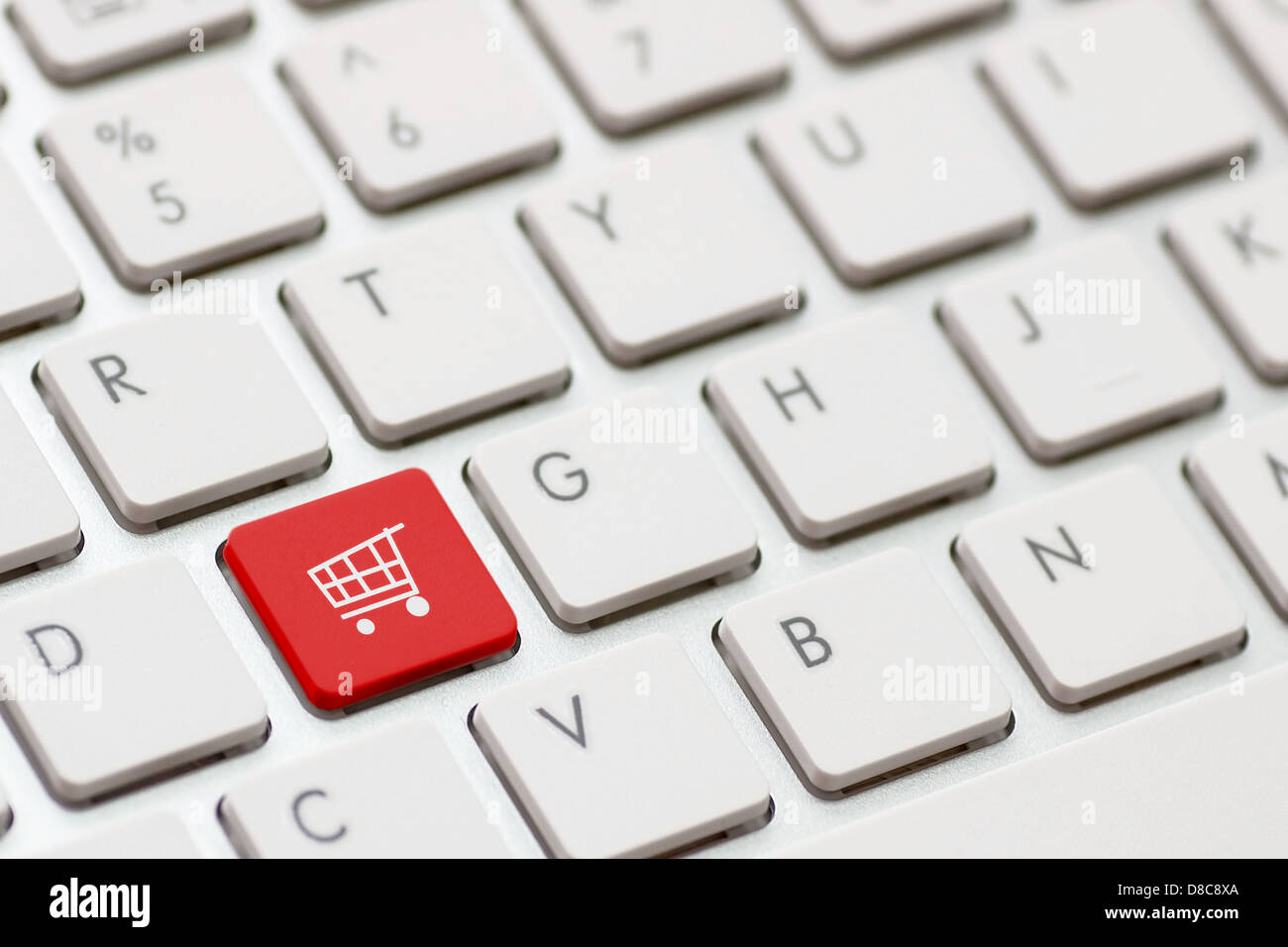 shopping enter button key on white keyboard Stock Photo - Alamy
