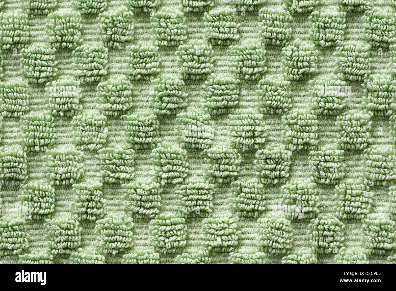 Macro shot of soft green towel with square pattern, green texture and ...