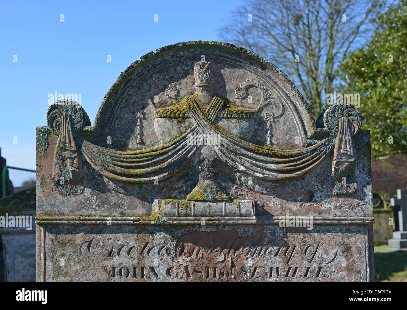 Gravestone with draped urn and bible design (detail). Church of St ...