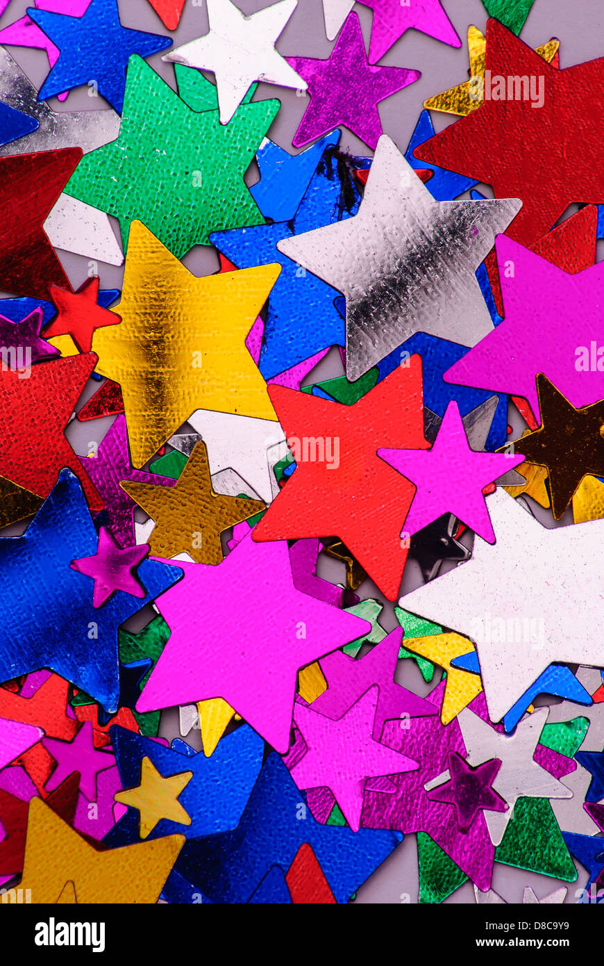 Multi coloured star shape cutouts used in crafting and carding making ...