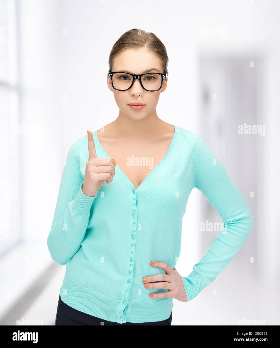 girl showing warning gesture Stock Photo - Alamy