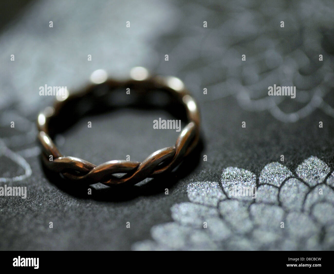 Twisted Ring on Paper Stock Photo - Alamy