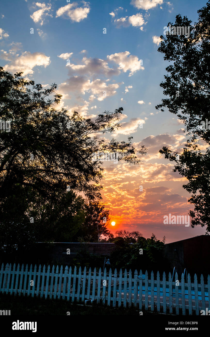 A colorful sunrise over a backyard swimming pool Stock Photo - Alamy