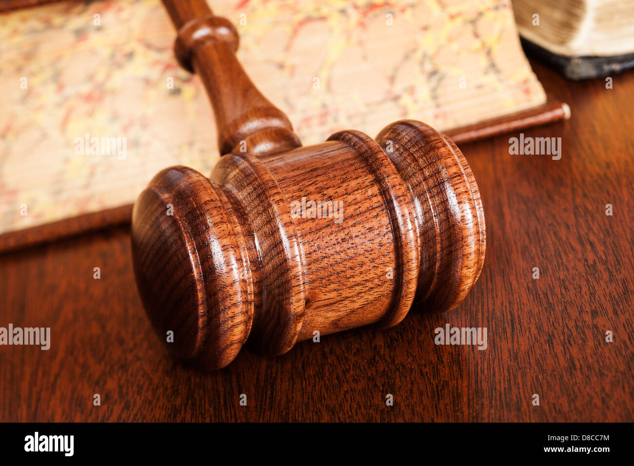 Gavel and Book on Desk - wooden gavel and old book on dark wood desk ...