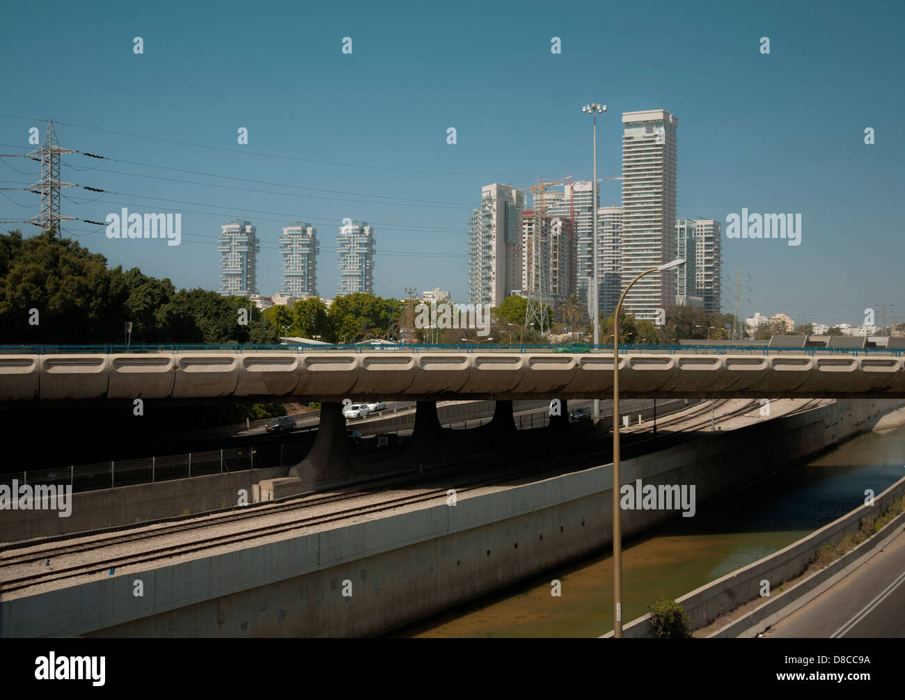 modern buildings canal, bridge and road with bridge in Tel Aviv, Israel ...