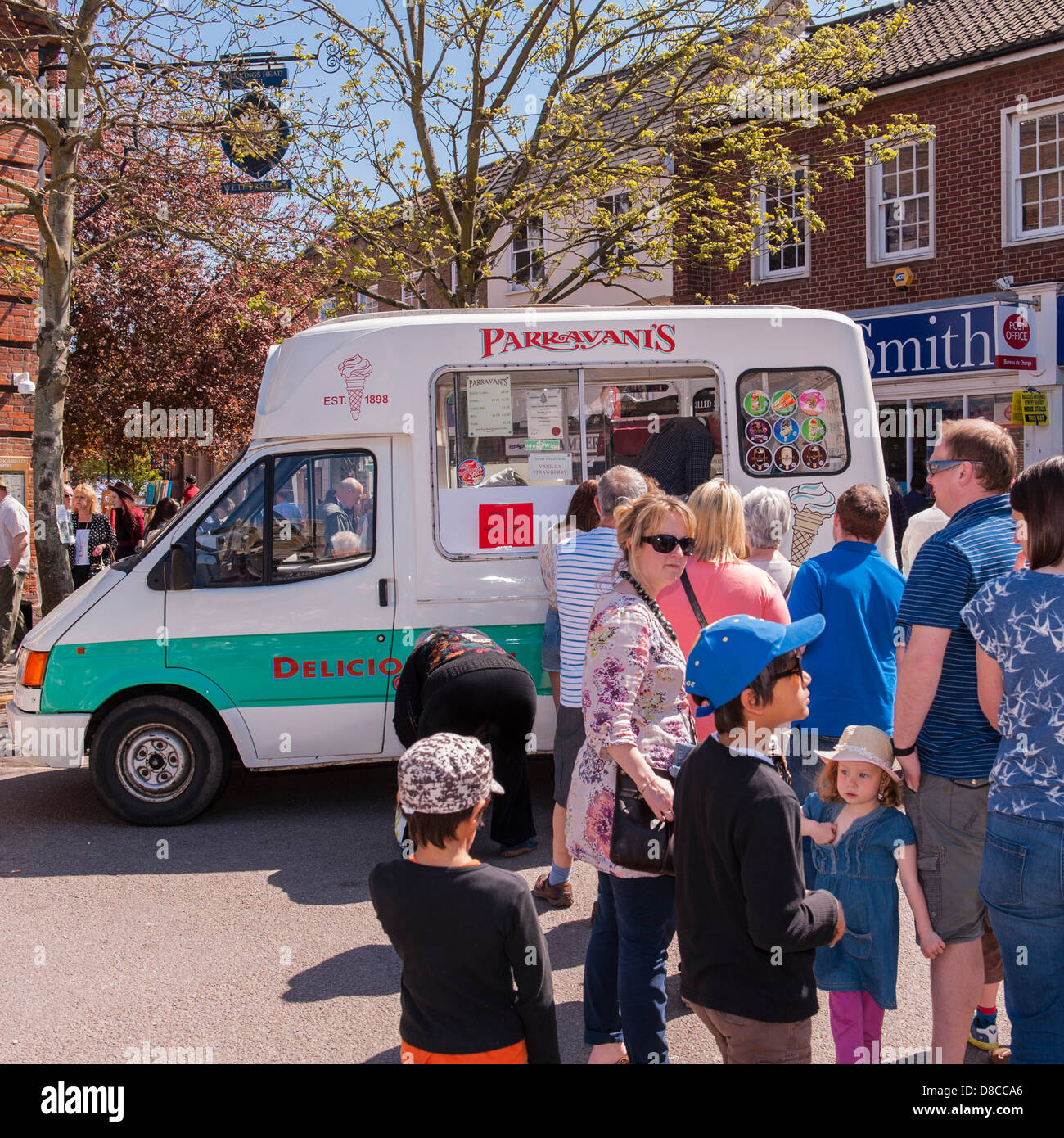 A queue for ice cream in the town centre of Beccles , Suffolk , England ...