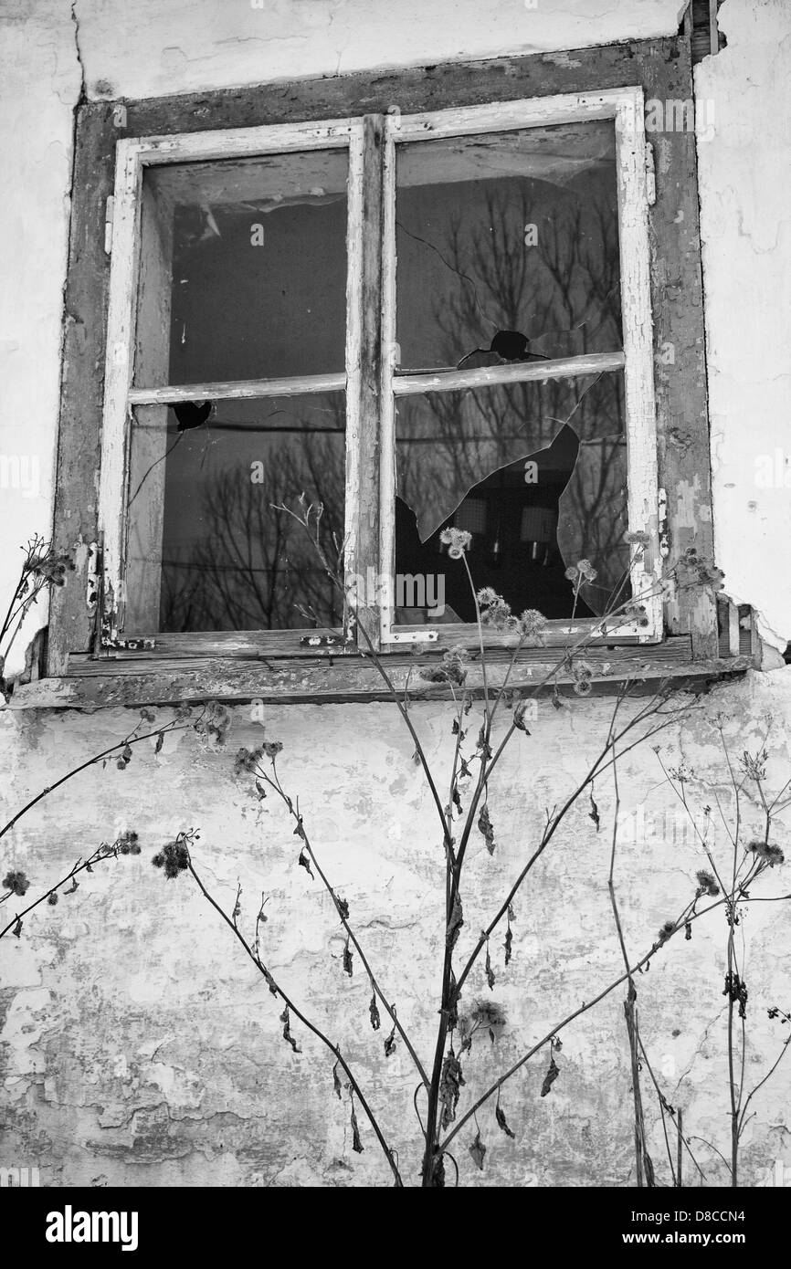 Broken window on old cottage Stock Photo - Alamy