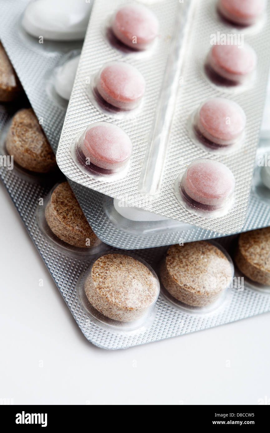 Bunch of colorful medicine pills on white background Stock Photo - Alamy