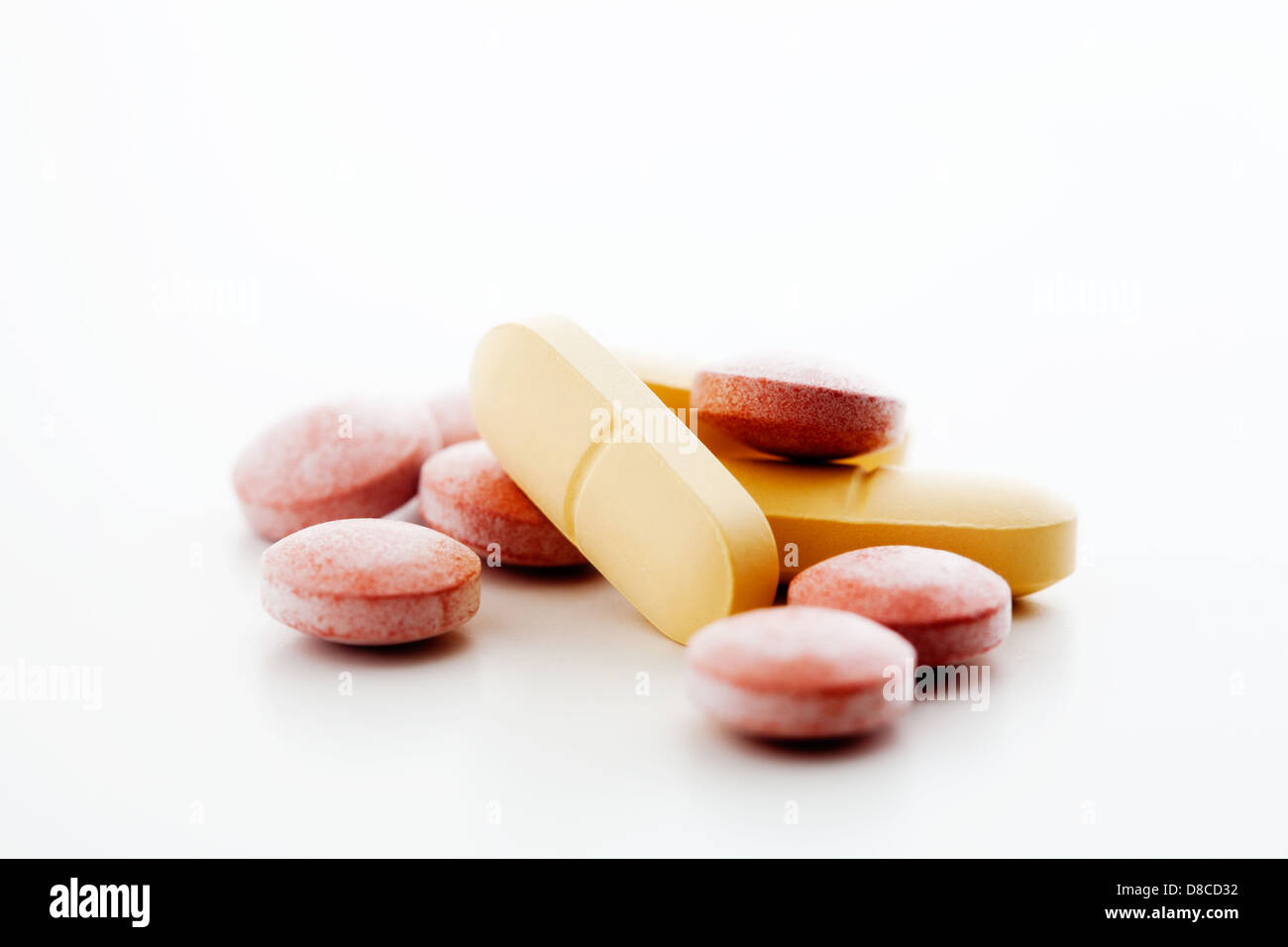 Bunch of colorful medicine pills on white background Stock Photo - Alamy