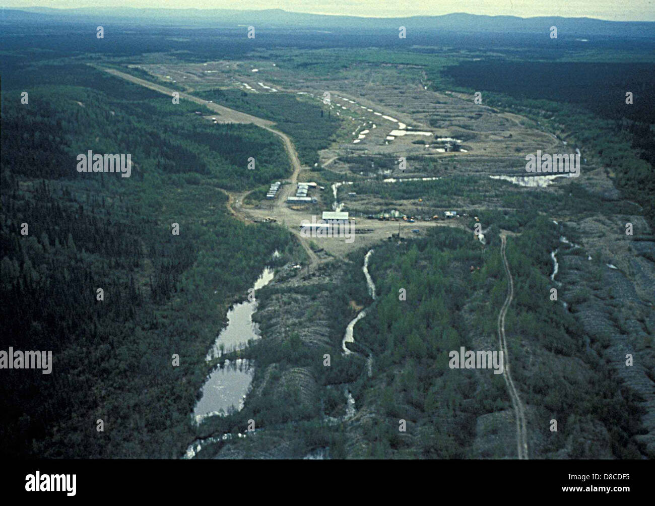 An aerial view of Hog River and a nearby placer mine, showing the river ...