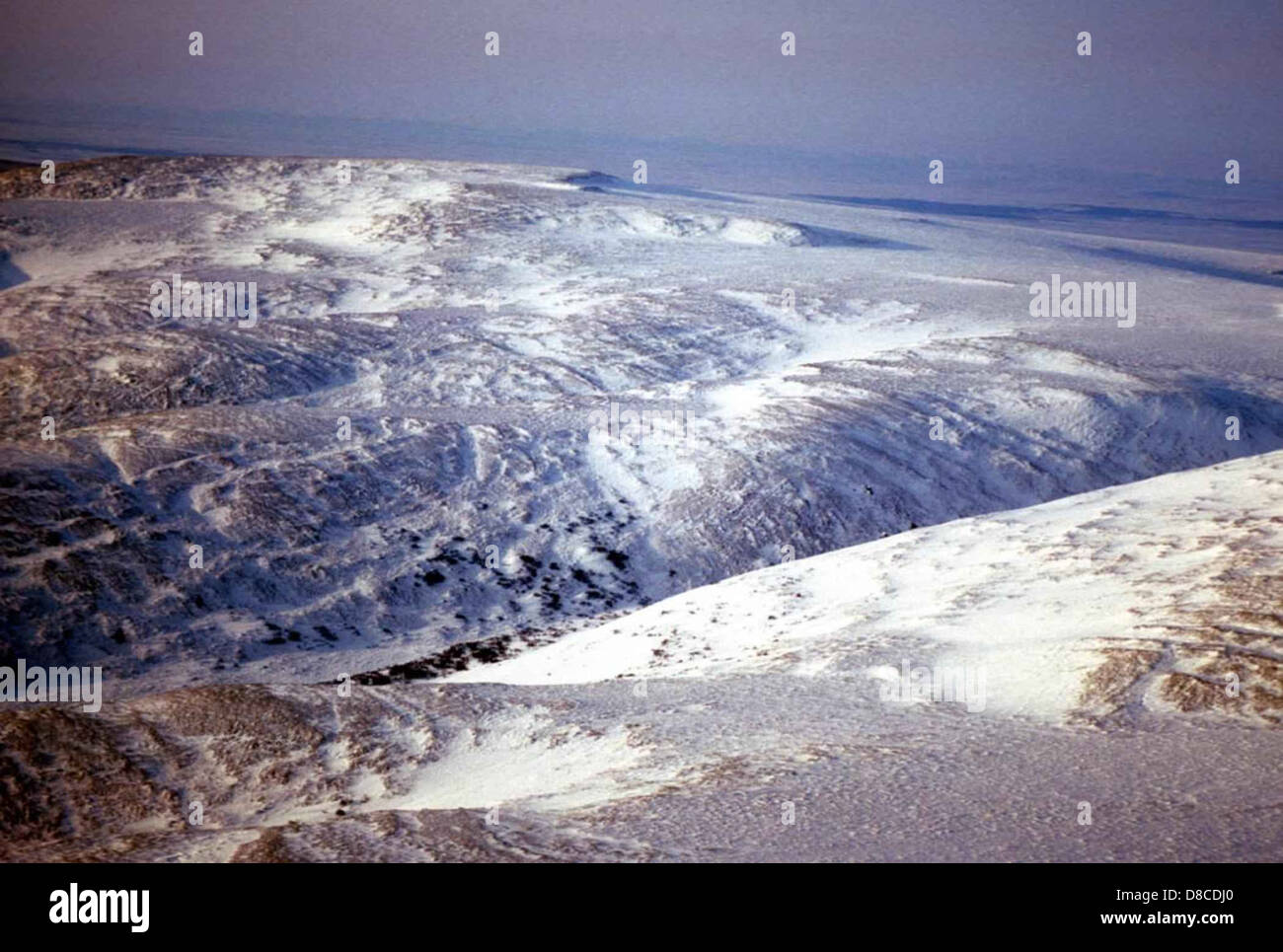 This aerial view captures the Purcell Mountains, showing their rugged ...