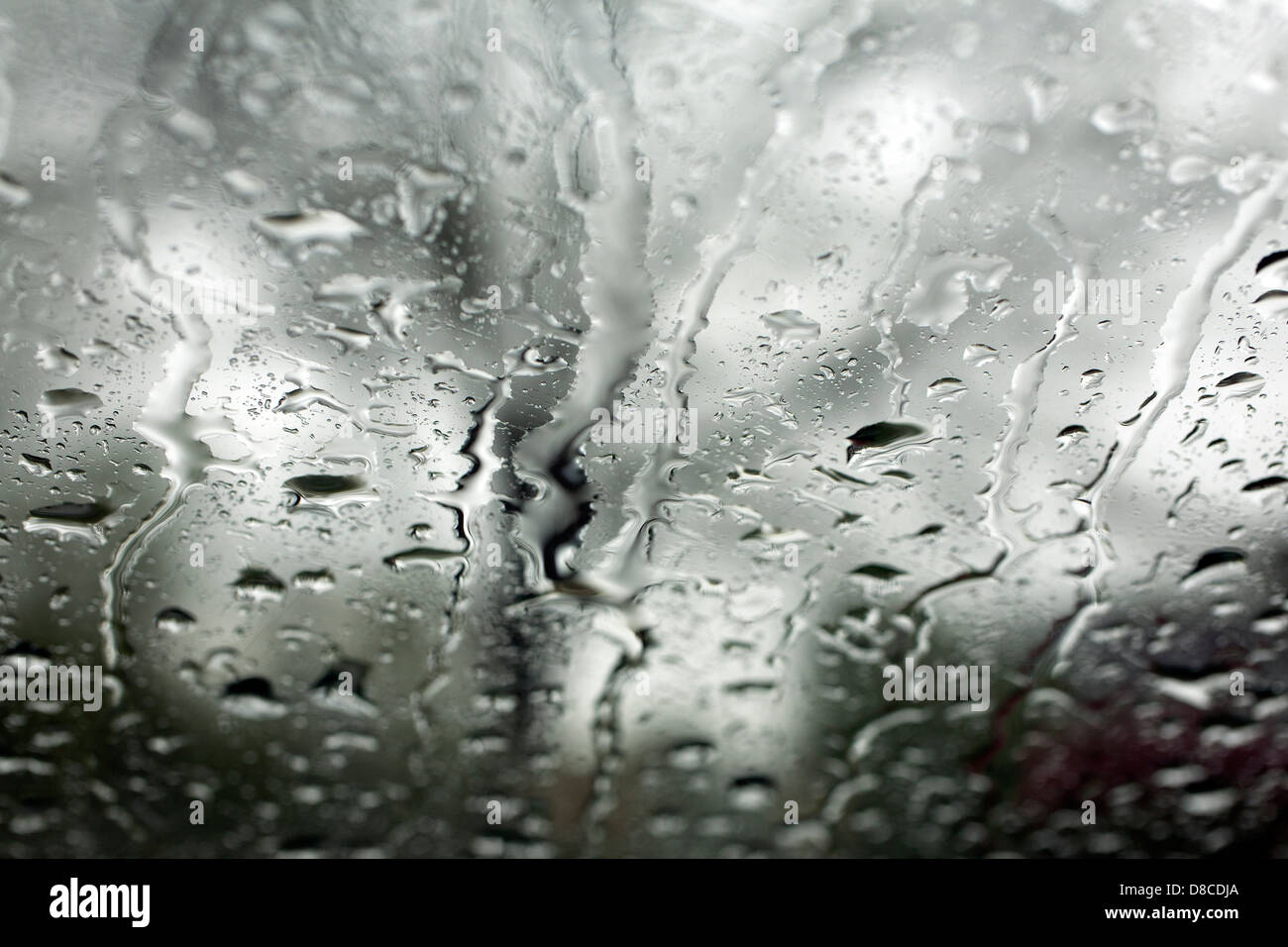 Raindrops trickle down glass hi-res stock photography and images - Alamy
