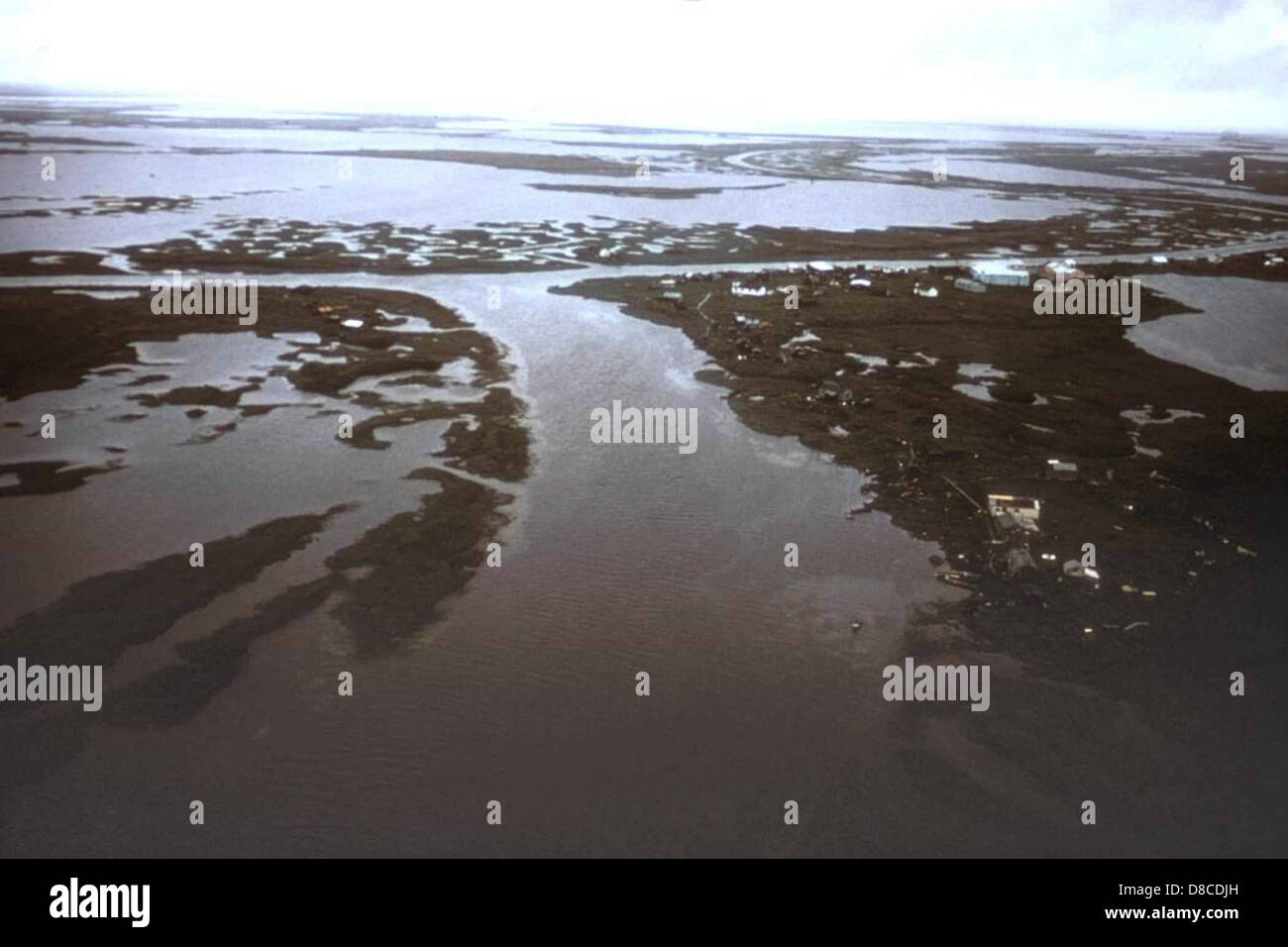 An aerial view of a native Alaskan village, showing traditional housing ...