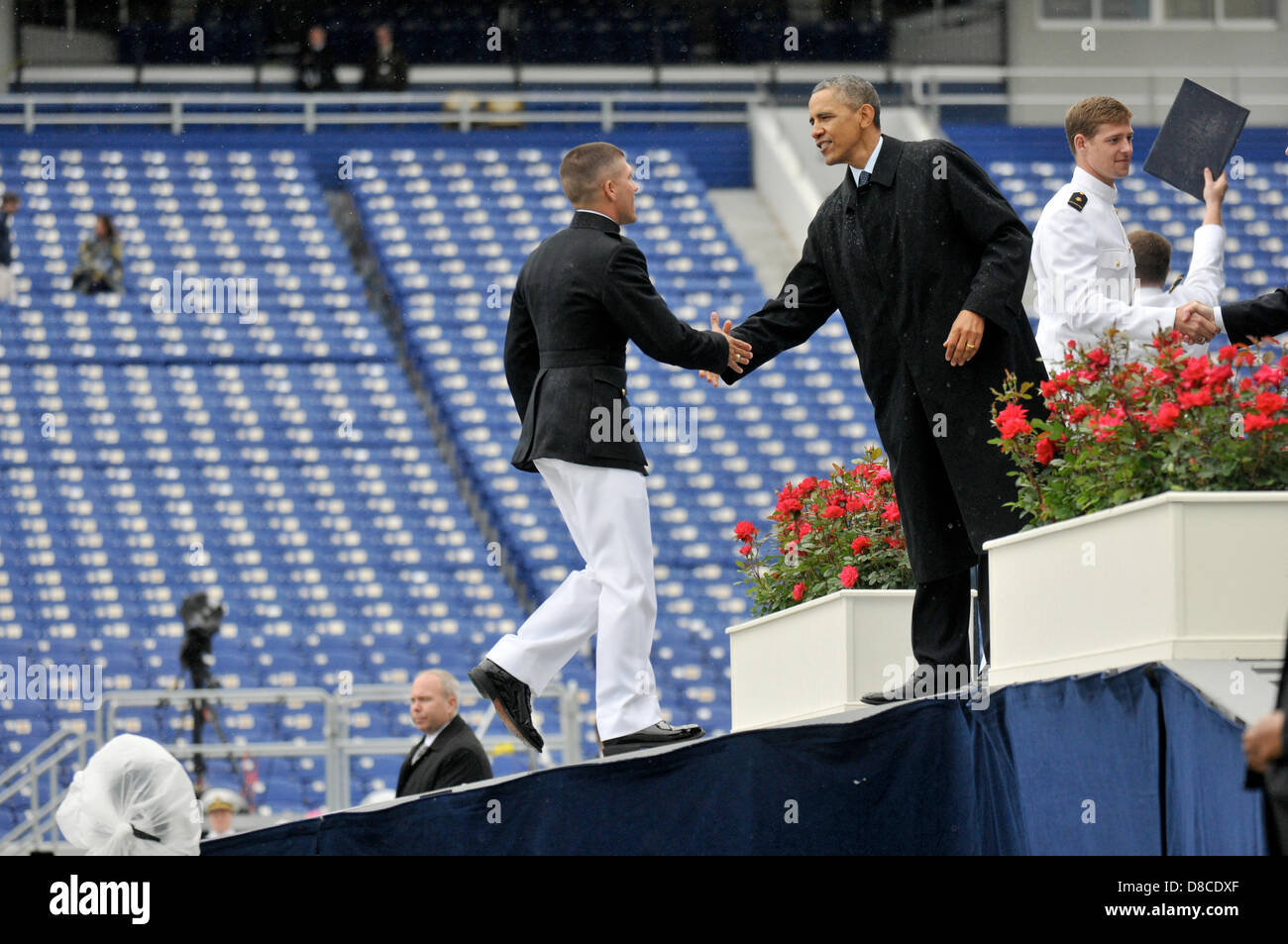 US President Barack Obama congratulates a Marine Corps graduate during ...