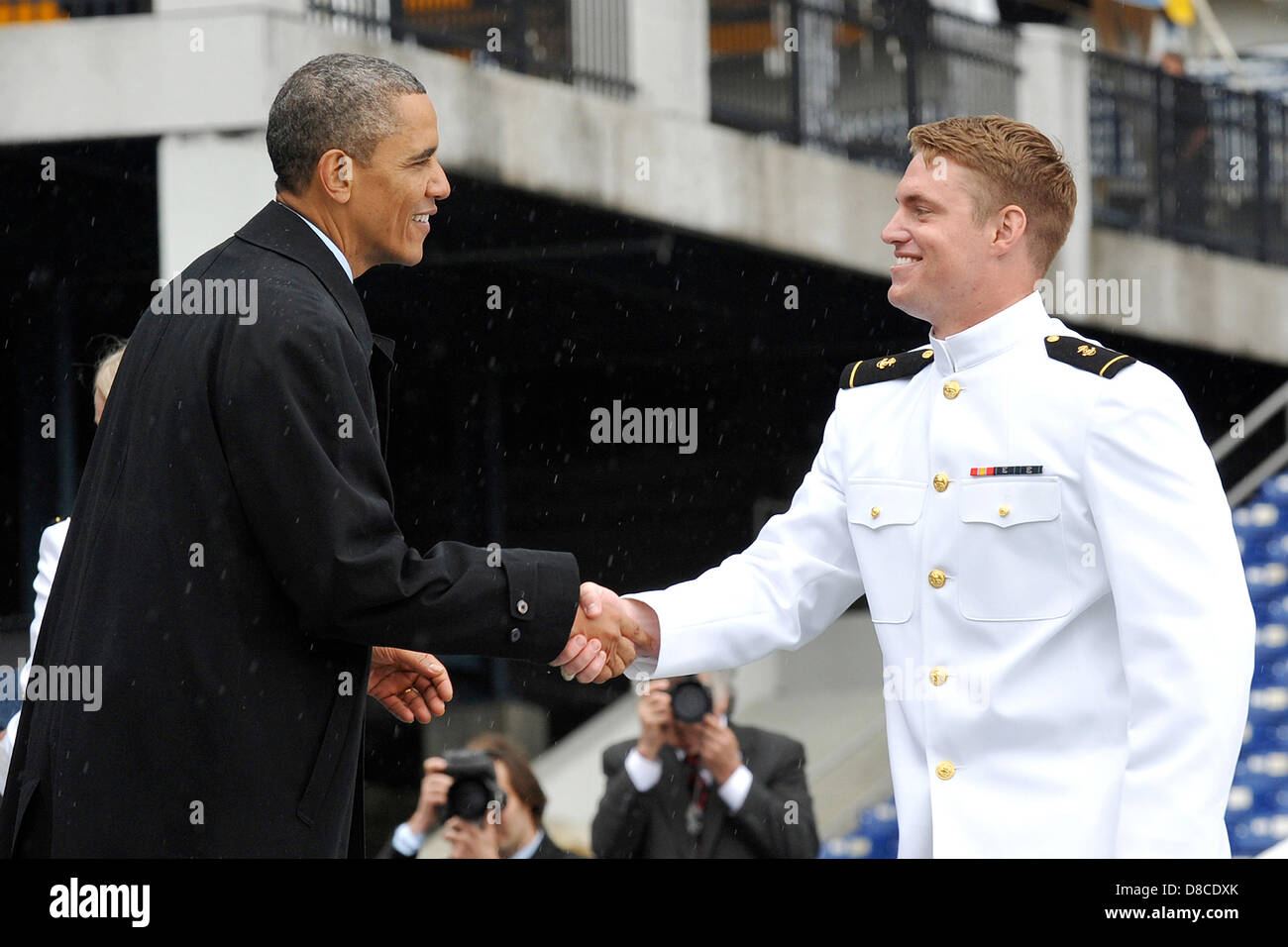 US President Barack Obama congratulates a Navy graduate during the US ...