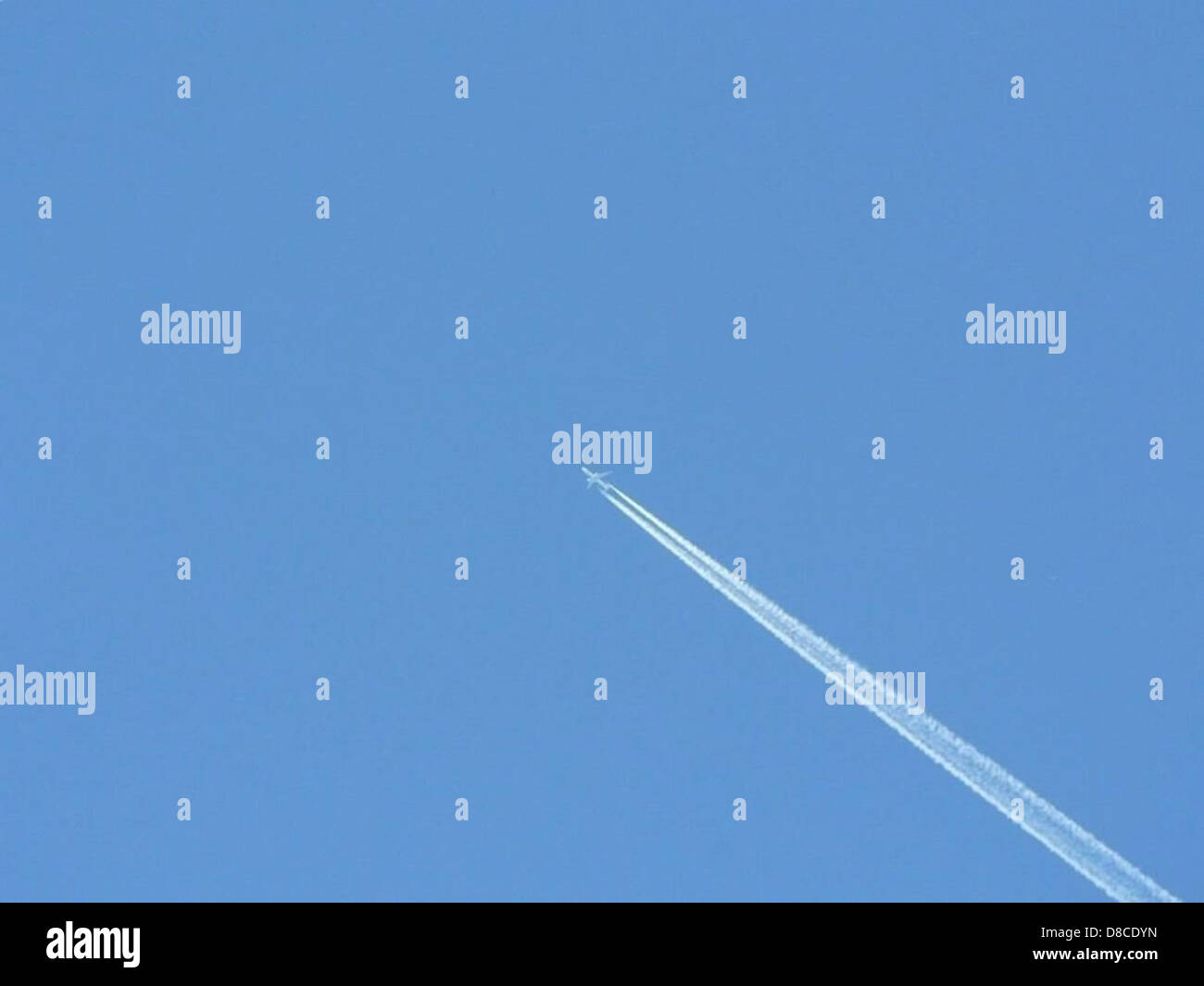 An airplane leaves a visible condensation trail in the sky, often known ...