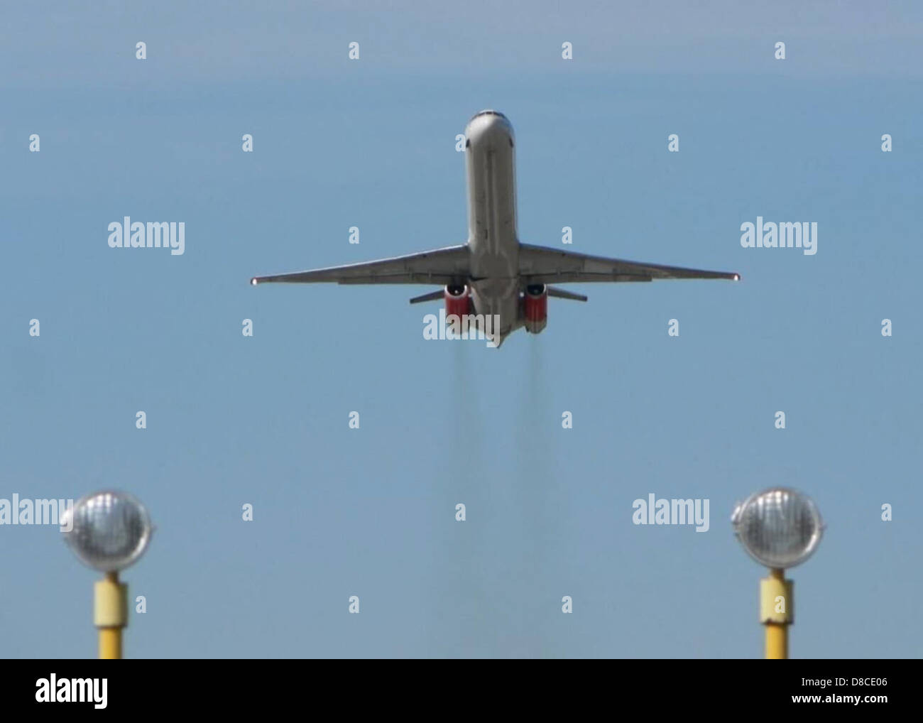 An airplane takes off from an airport runway, accelerating as it lifts ...
