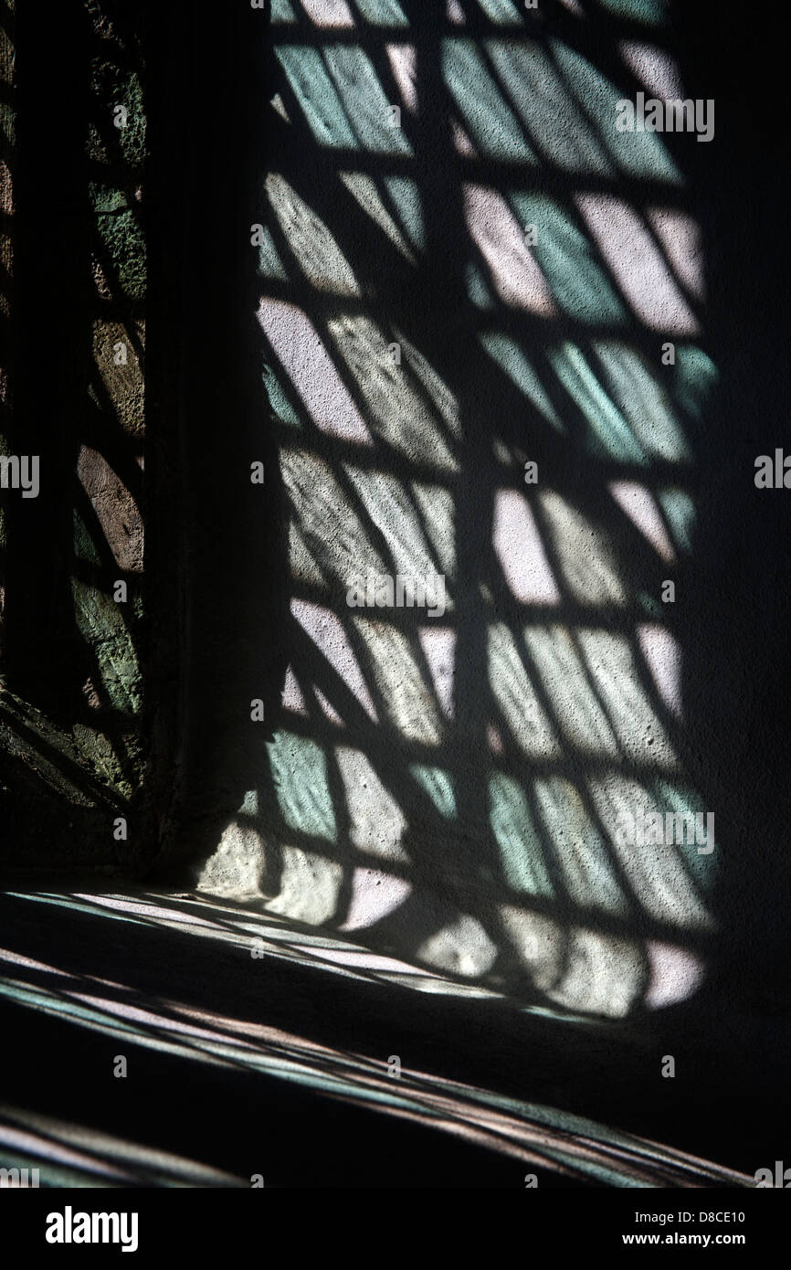 Shadows from a glass window cast on a wall inside St Levans Church ...