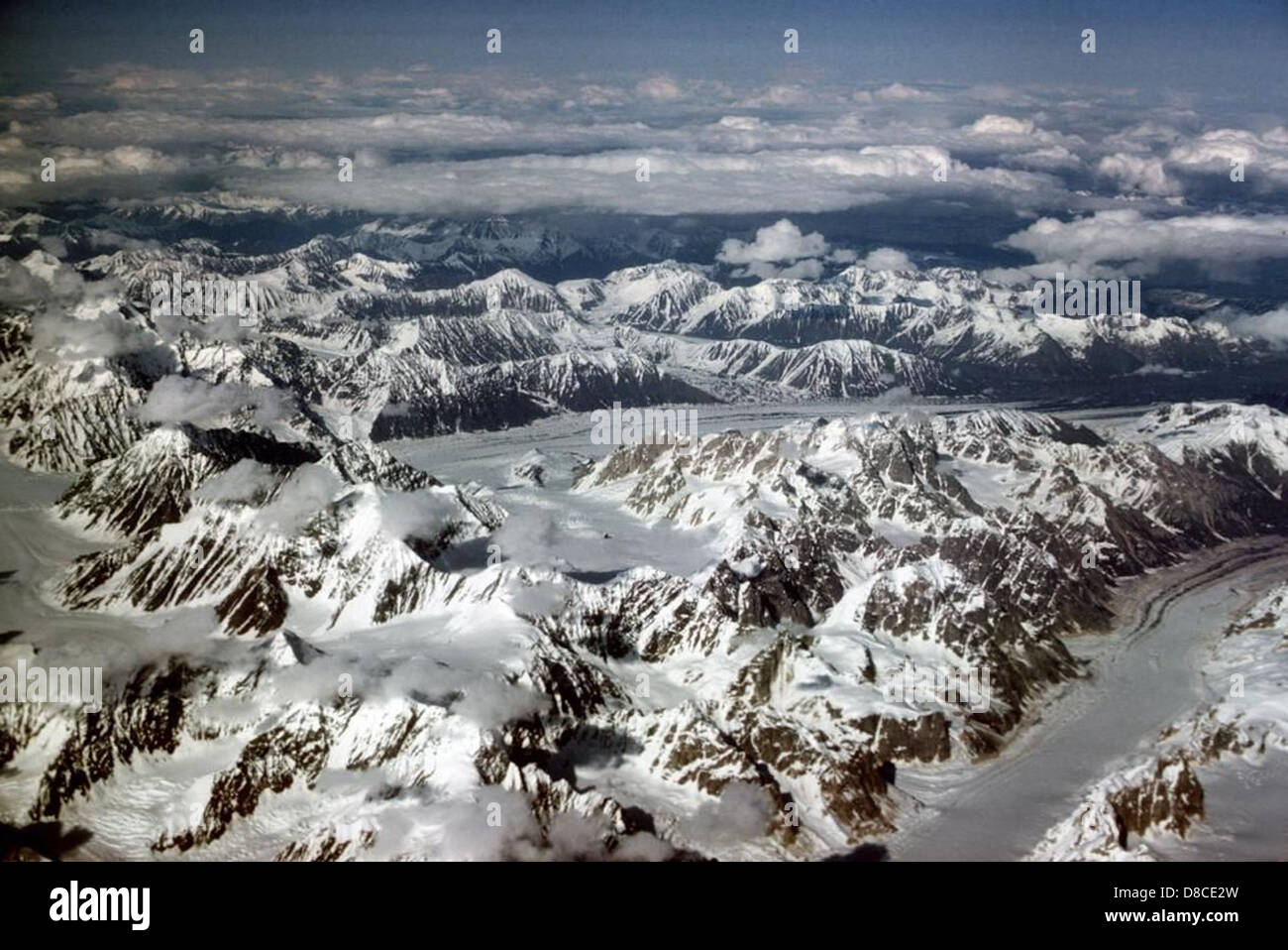 This image captures the stunning peaks of the Alaska Range, a major ...