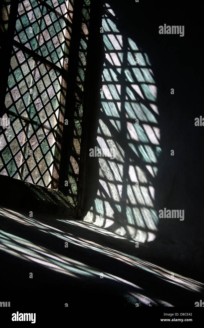 Shadows from a glass window cast on a wall inside St Levans Church ...