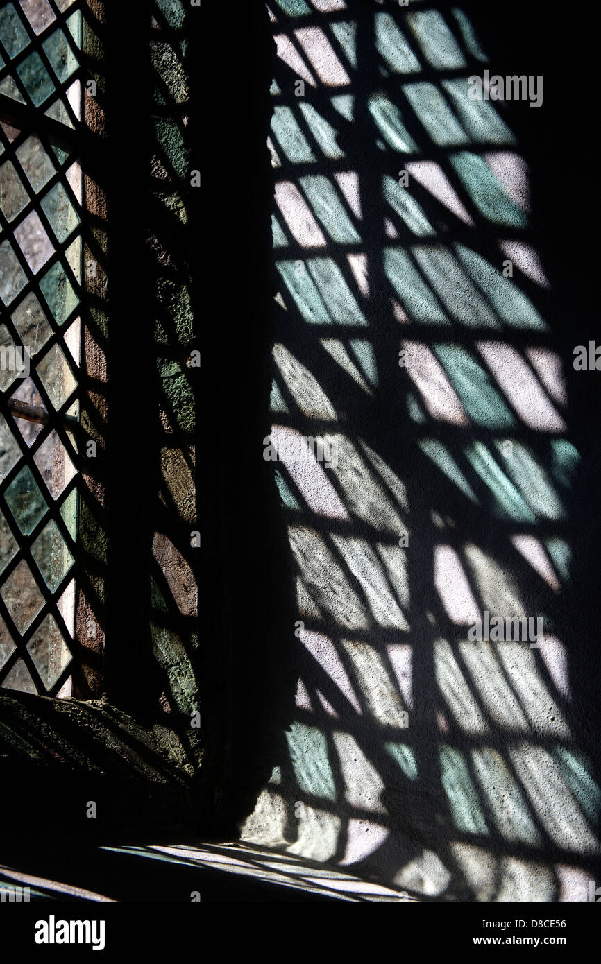 Shadows from a glass window cast on a wall inside St Levans Church ...