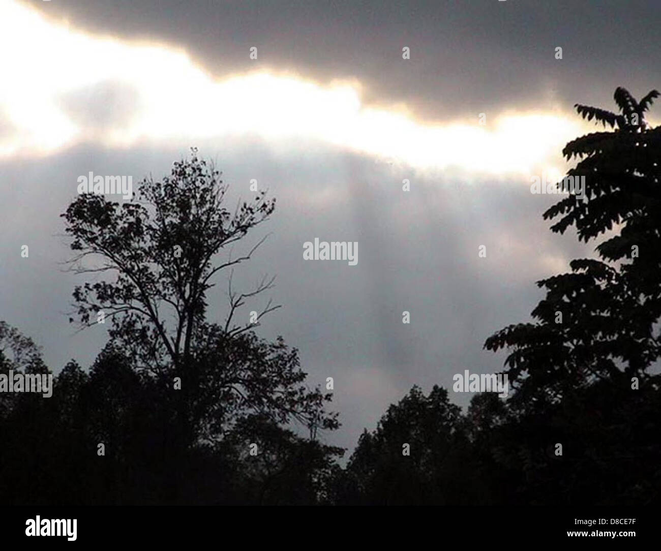An image depicting a dramatic sky, with dark, threatening clouds. This ...