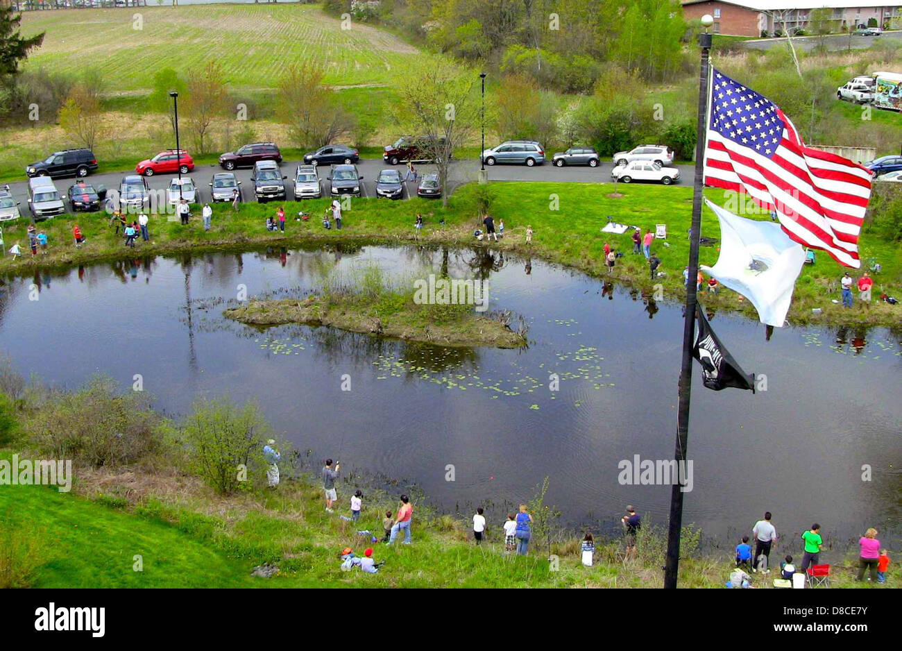 A group of anglers participating in an annual fishing derby, competing ...