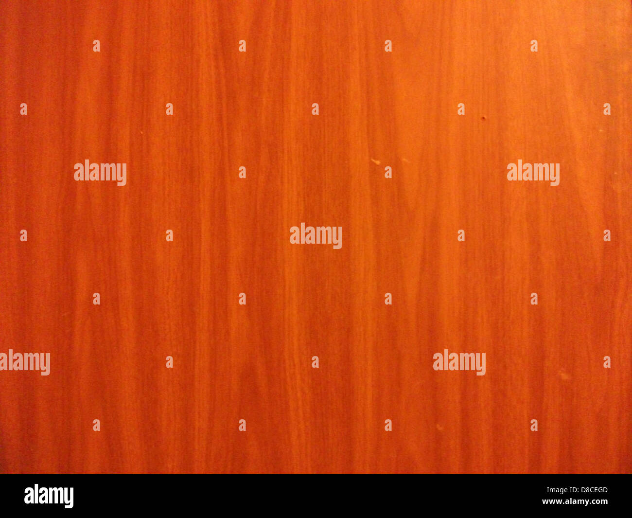 A close-up of an artificial wood surface, mimicking natural wood grain ...