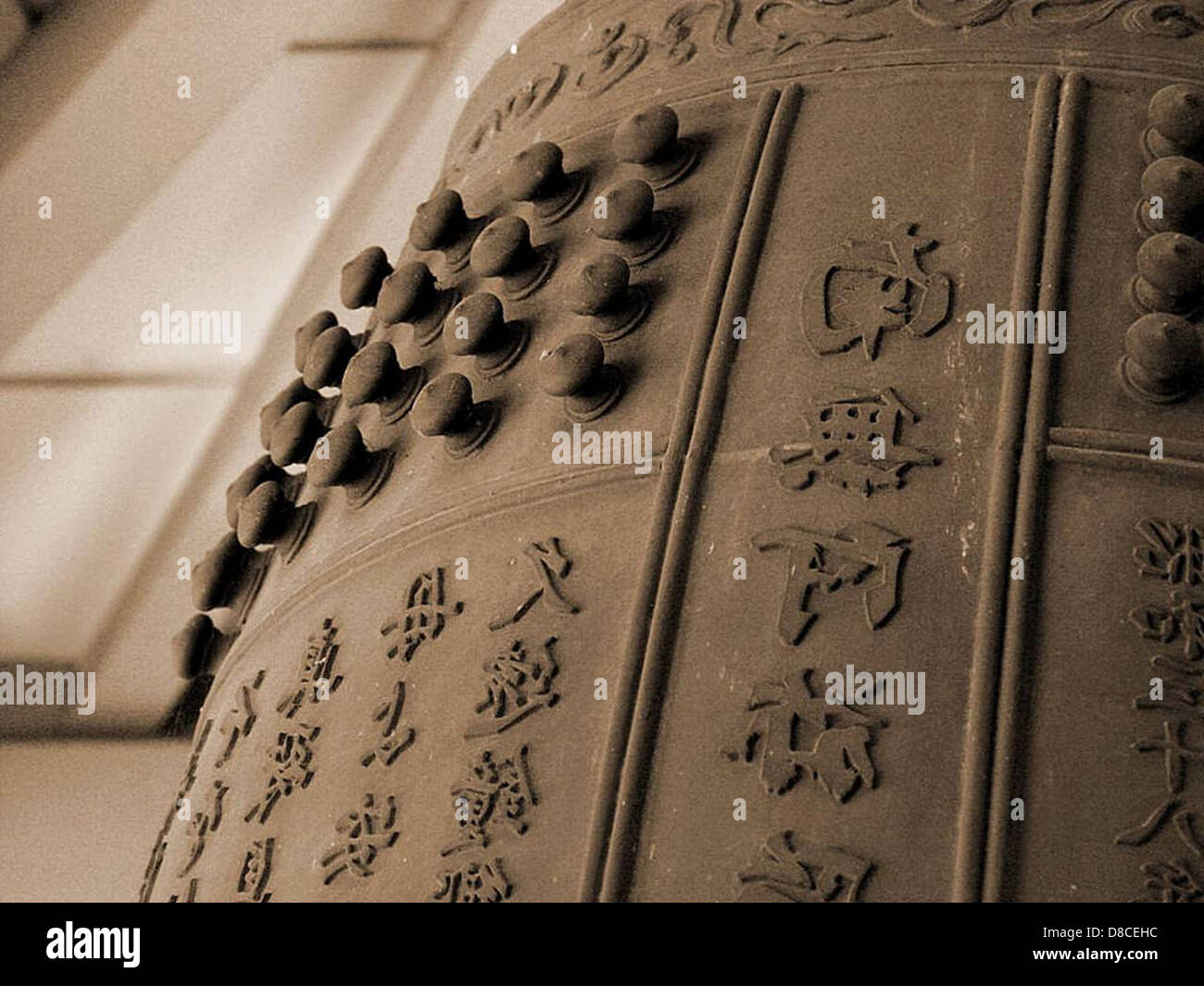 An ornamental Asian bell, featuring traditional designs and symbols ...