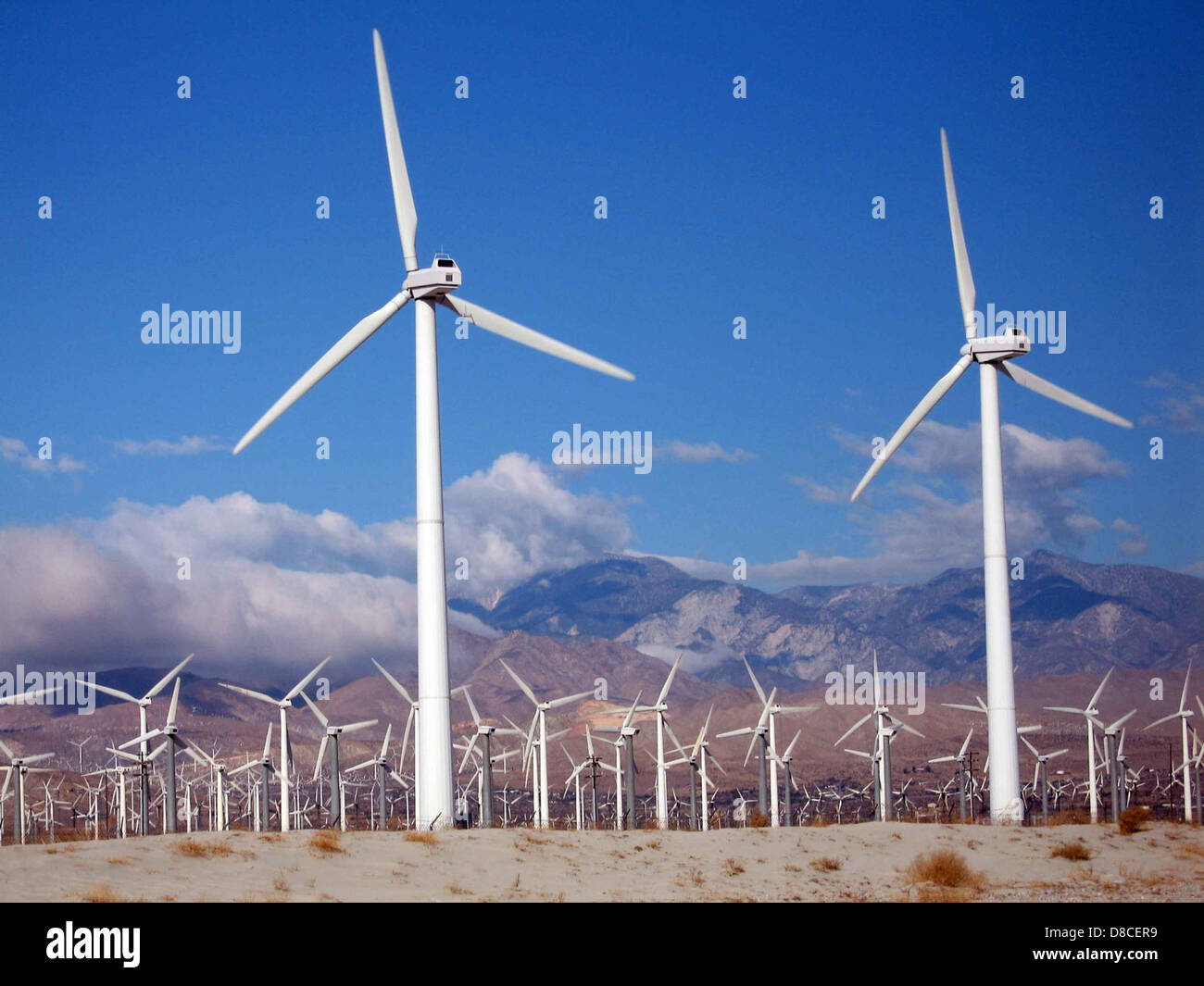 A detailed close-up shot of wind turbines in a wind farm, with their ...