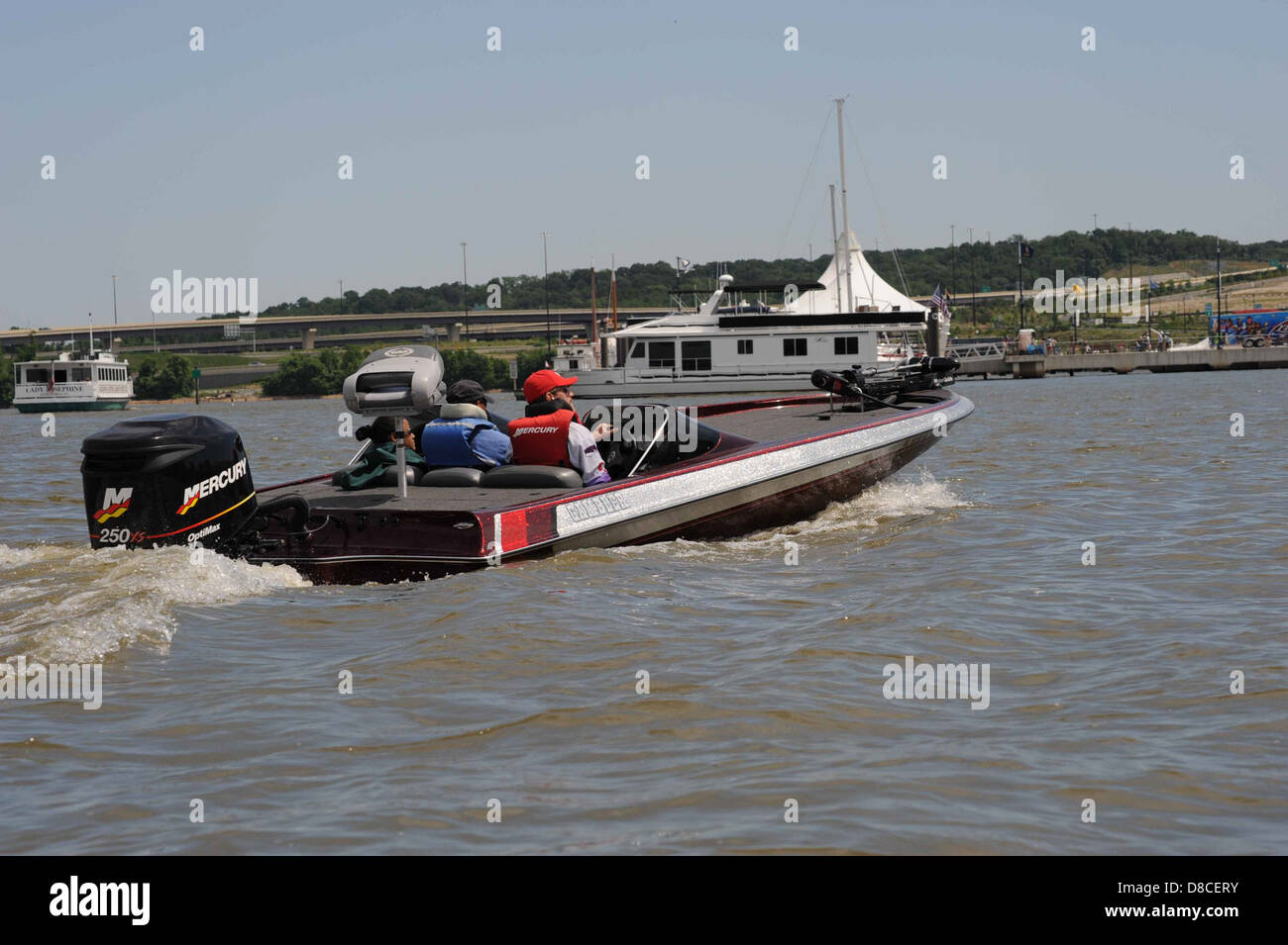 A fast boat is heading toward a dock, with its speed creating a ...
