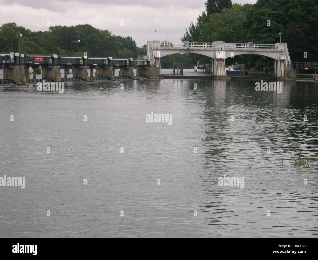 A weir on the River Thames at Teddington, London, controls water flow ...