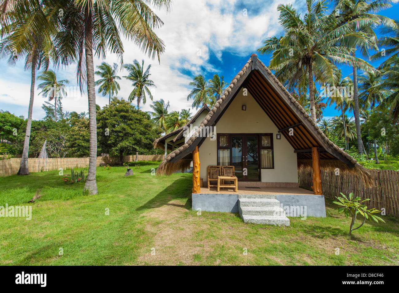 Traditional style accommodation on tropical island Stock Photo - Alamy