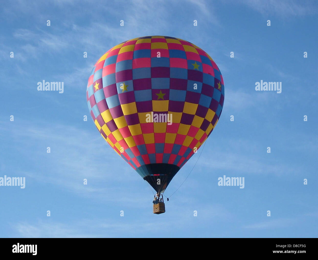 This image features a free-floating balloon in the sky, surrounded by ...