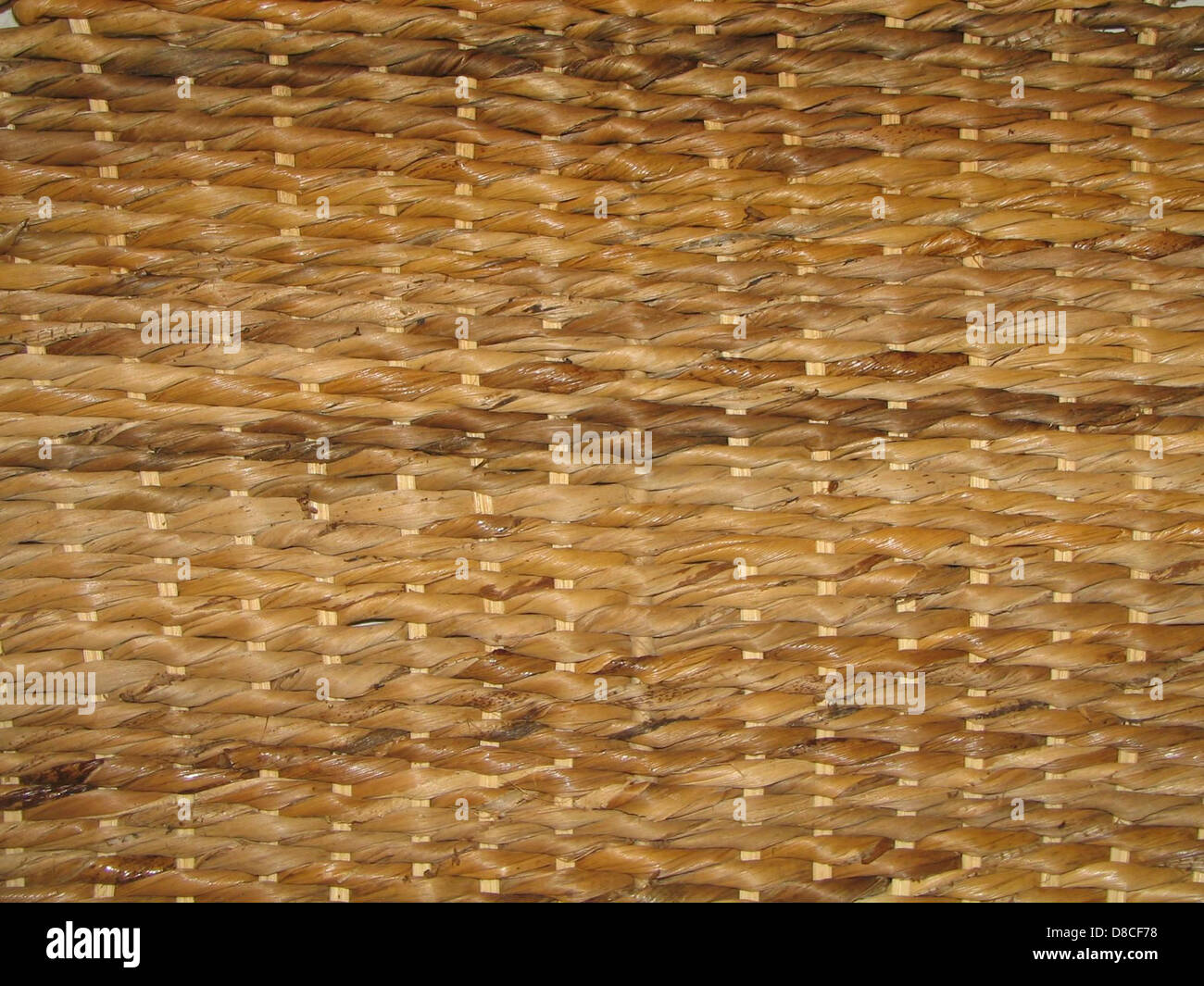 A close-up shot of a wicker basket, showcasing the intricate weaving technique. The basket is ...