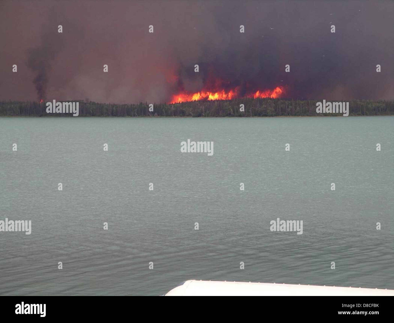 Big dark smoke rising from fire flames in forest Stock Photo - Alamy