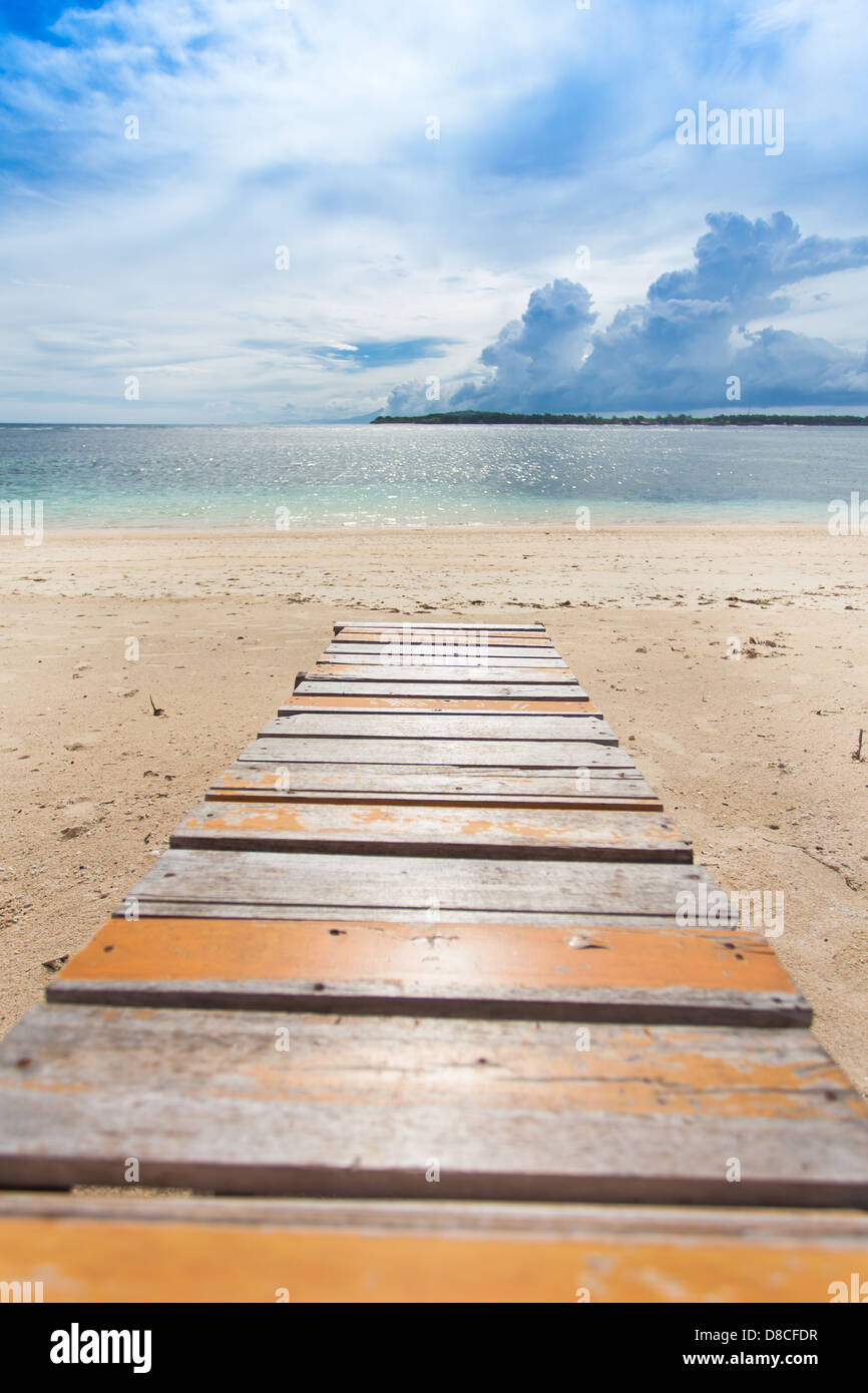 Wooden jetty on tropical beach on island Stock Photo - Alamy