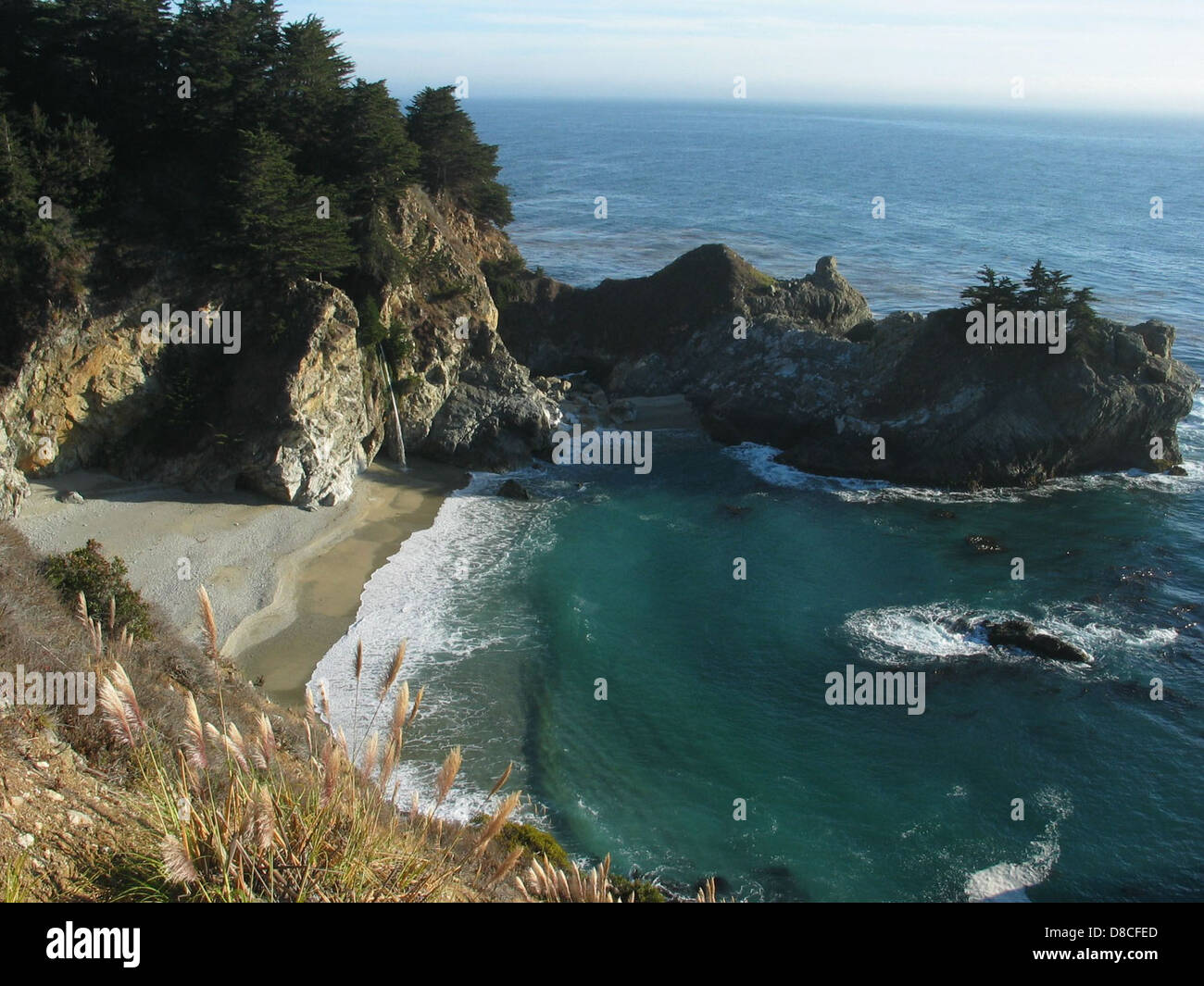 A stunning view of an ocean cove along the Big Sur coastline, known for ...