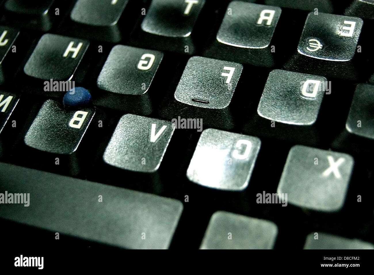 A black computer keyboard with standard keys, captured in a close-up ...