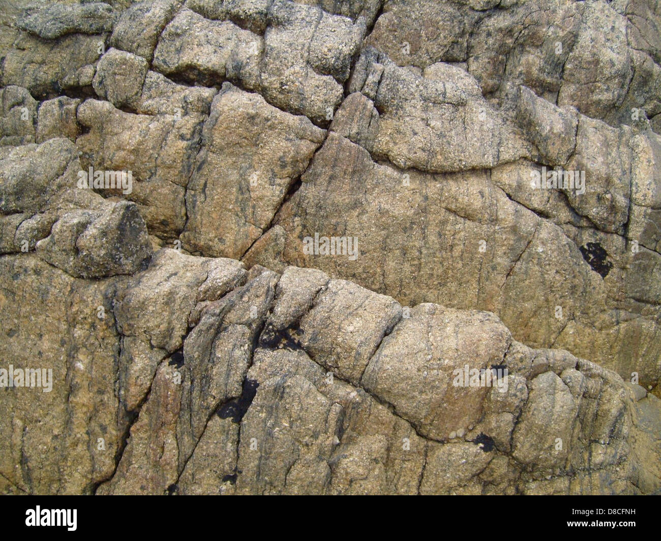 A simple block of stone, possibly used for construction, displaying its ...