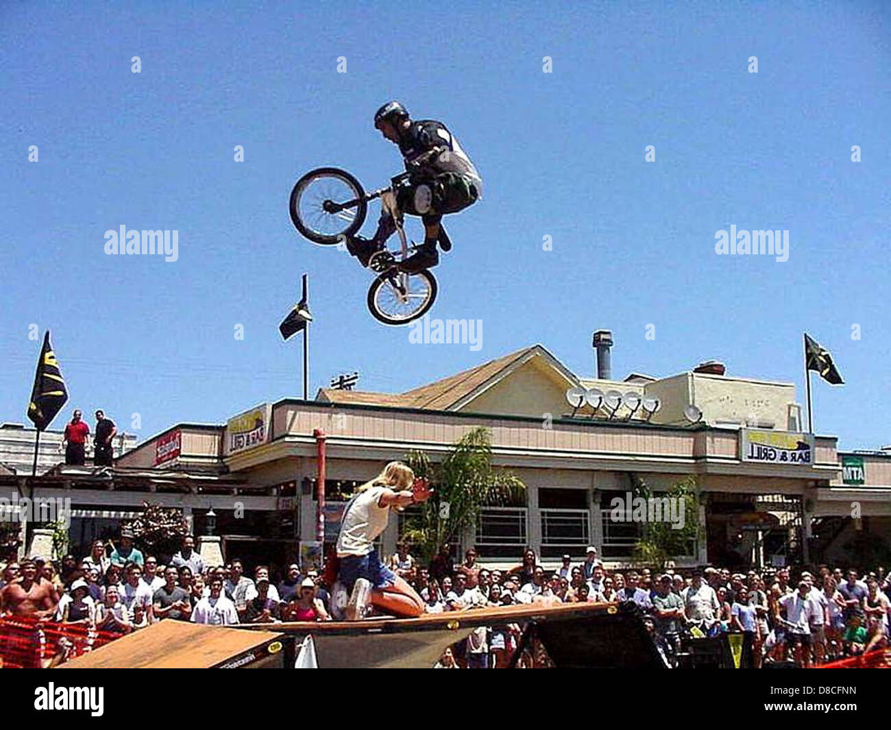 A vibrant scene at Pacific Beach, featuring people enjoying a block ...