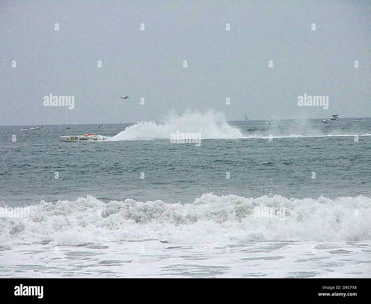 Boats races ocean waves water Stock Photo - Alamy
