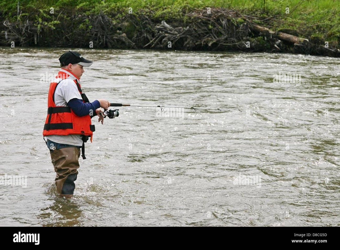 Boy fishing in creek hi-res stock photography and images - Alamy