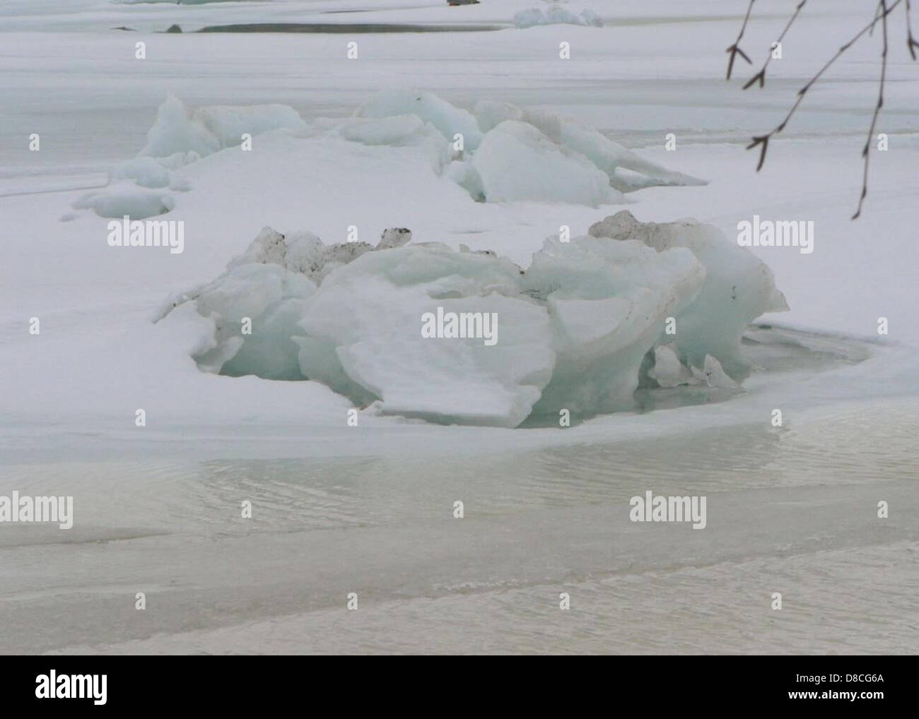 The image captures the moment when ice begins to crack and break, with ...