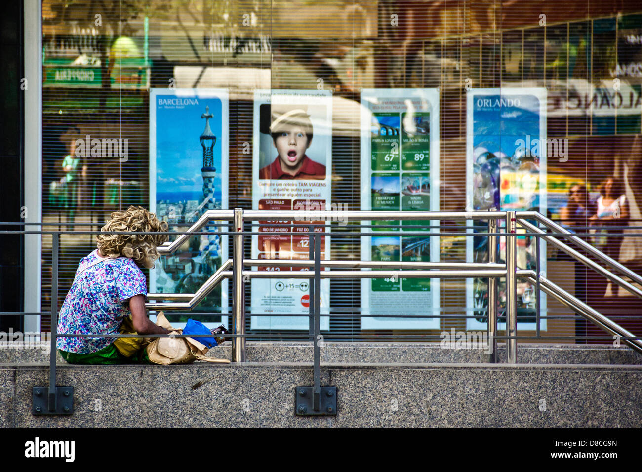 Homeless woman at the door of the subway station Stock Photo - Alamy