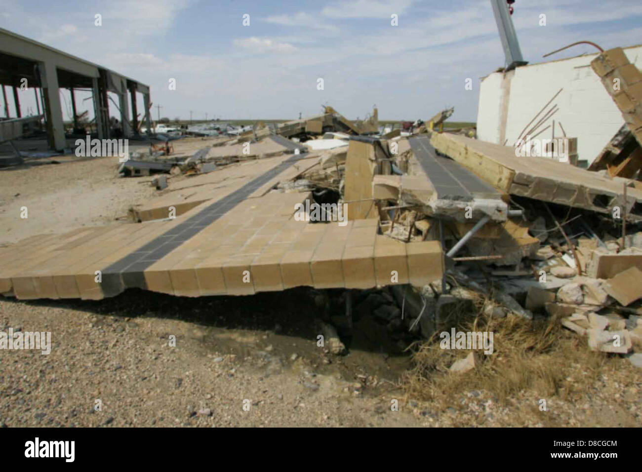 A building severely damaged by hurricane winds, showing signs of ...